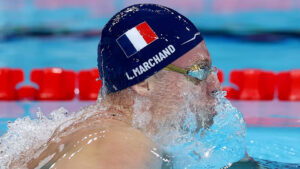 French Swimmer Léon Marchand Captures Gold, Breaks Olympic Record ...